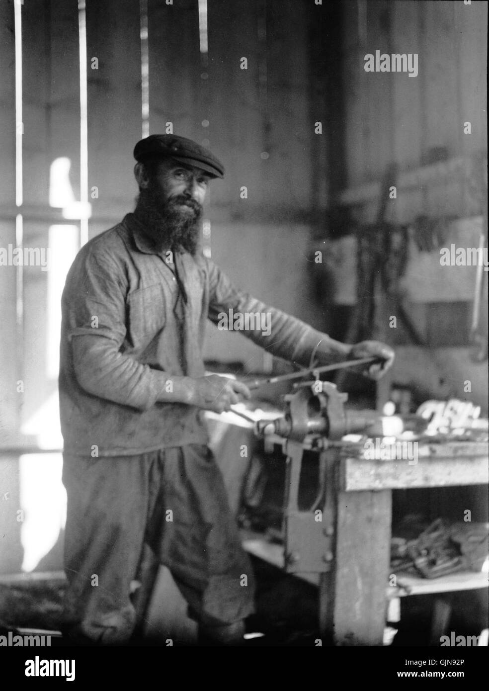 The photograph depicts the blacksmith shop of the Jewish colony K'far ...