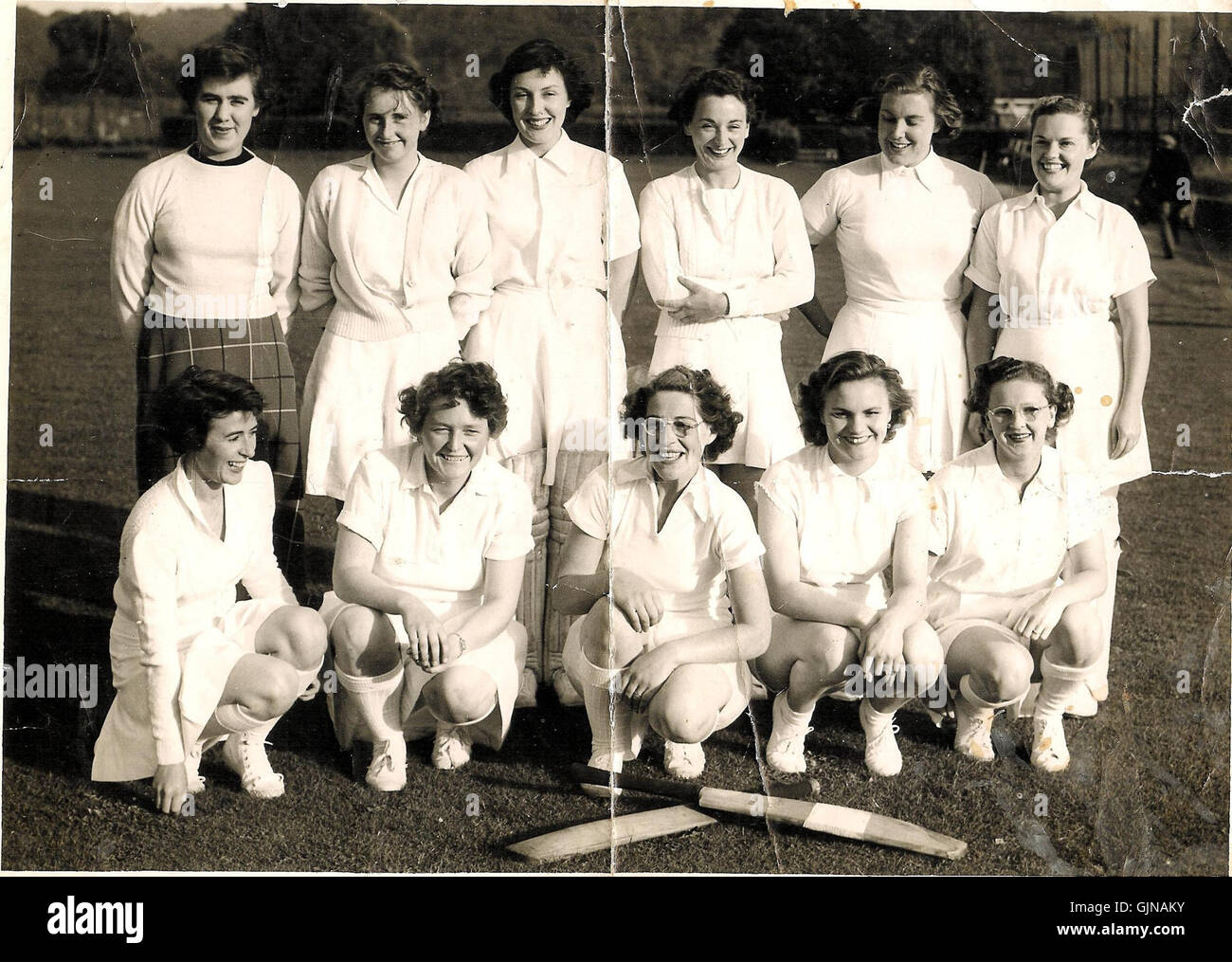 This photograph captures a women's cricket team from the 1950s ...