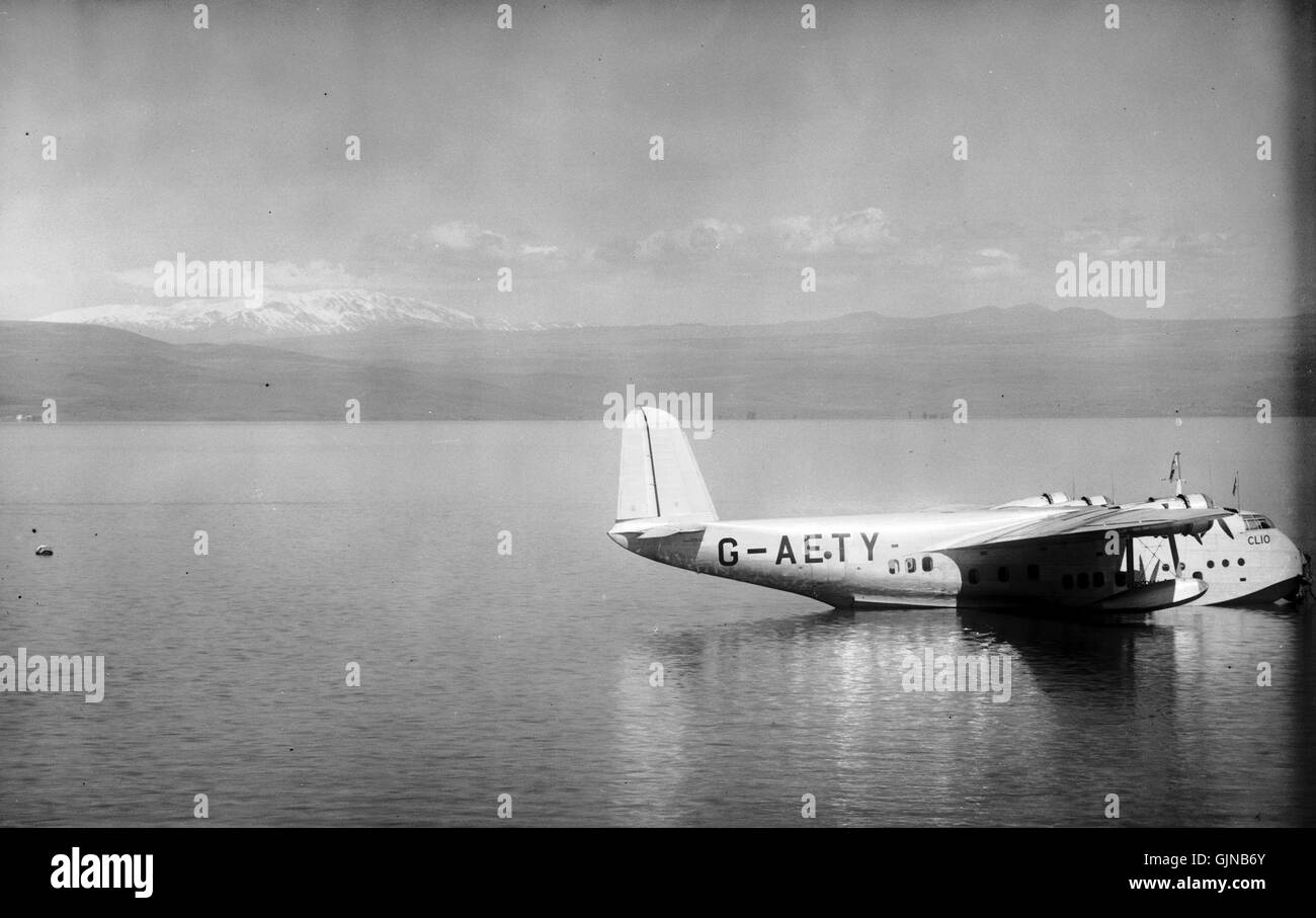Lido, flying boat Clio. Flying boat Clio on the lake with snow capped ...