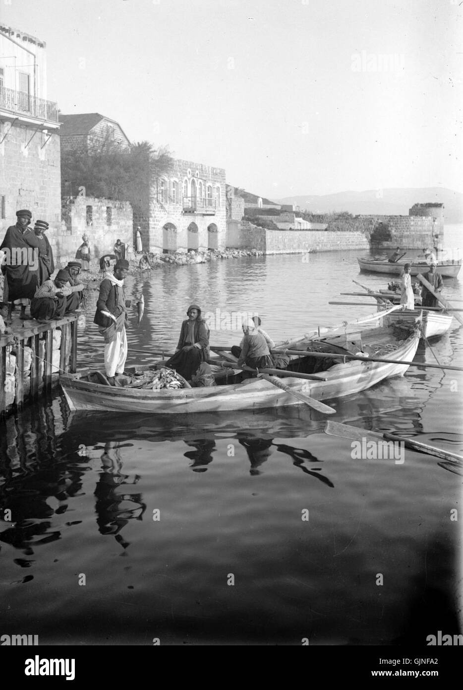 A photograph or artwork from 1900-1920 depicting a boat filled with ...