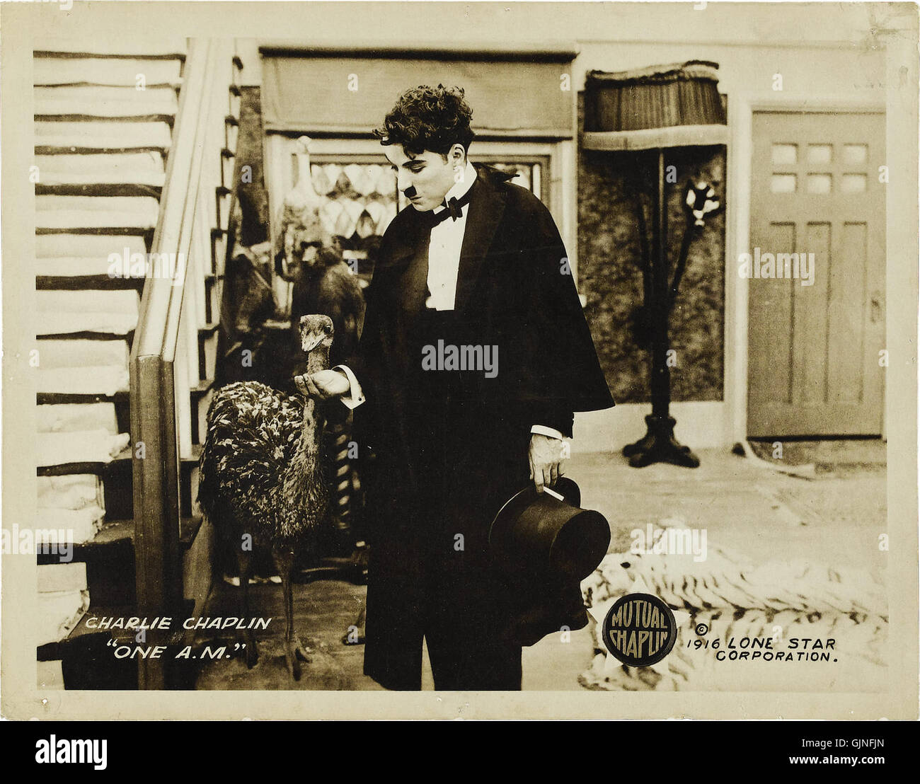 Lobby card for the 1921 Charlie Chaplin film 'One A.M.', depicting a ...