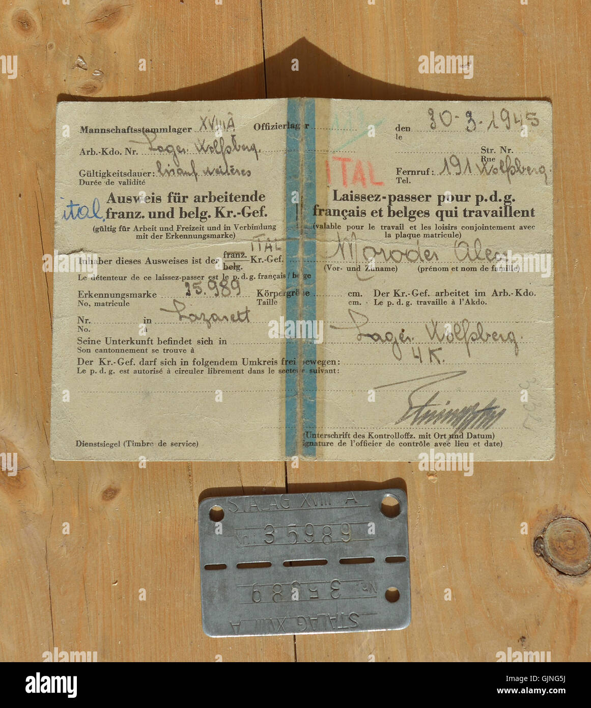 A permit and badge issued to a prisoner of war at Stalag XVIII-A during ...