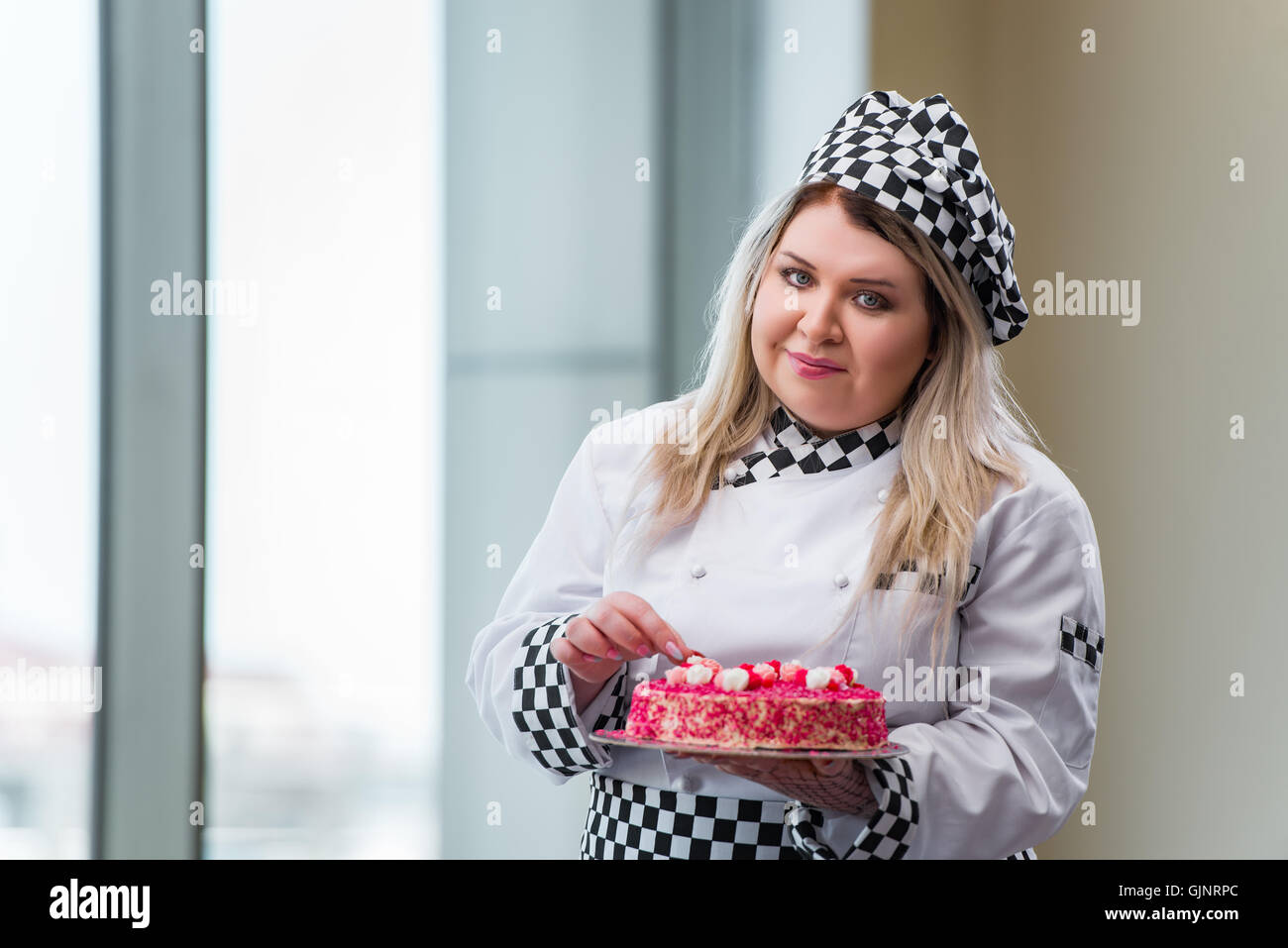 Young woman chef preparing dessert cak Stock Photo - Alamy