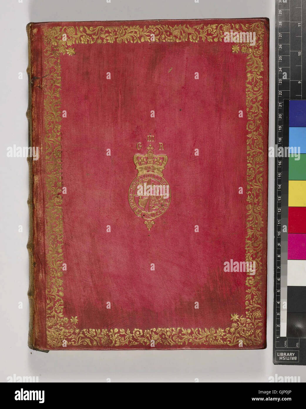 This piece features the upper cover of a historical manuscript or book ...