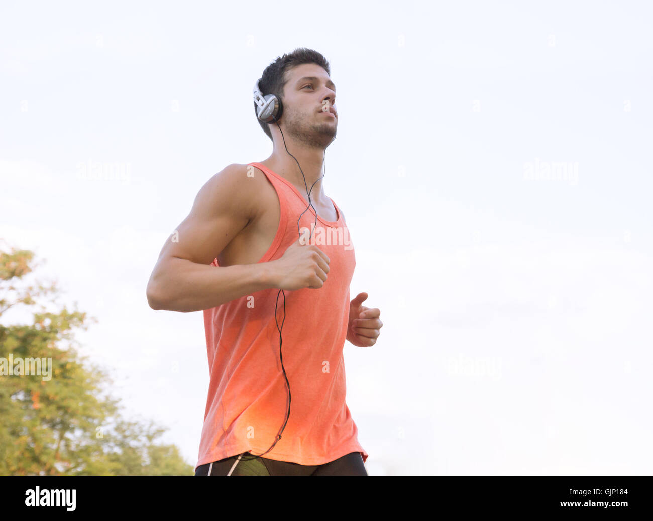 young man jogger runner close up side view Stock Photo - Alamy