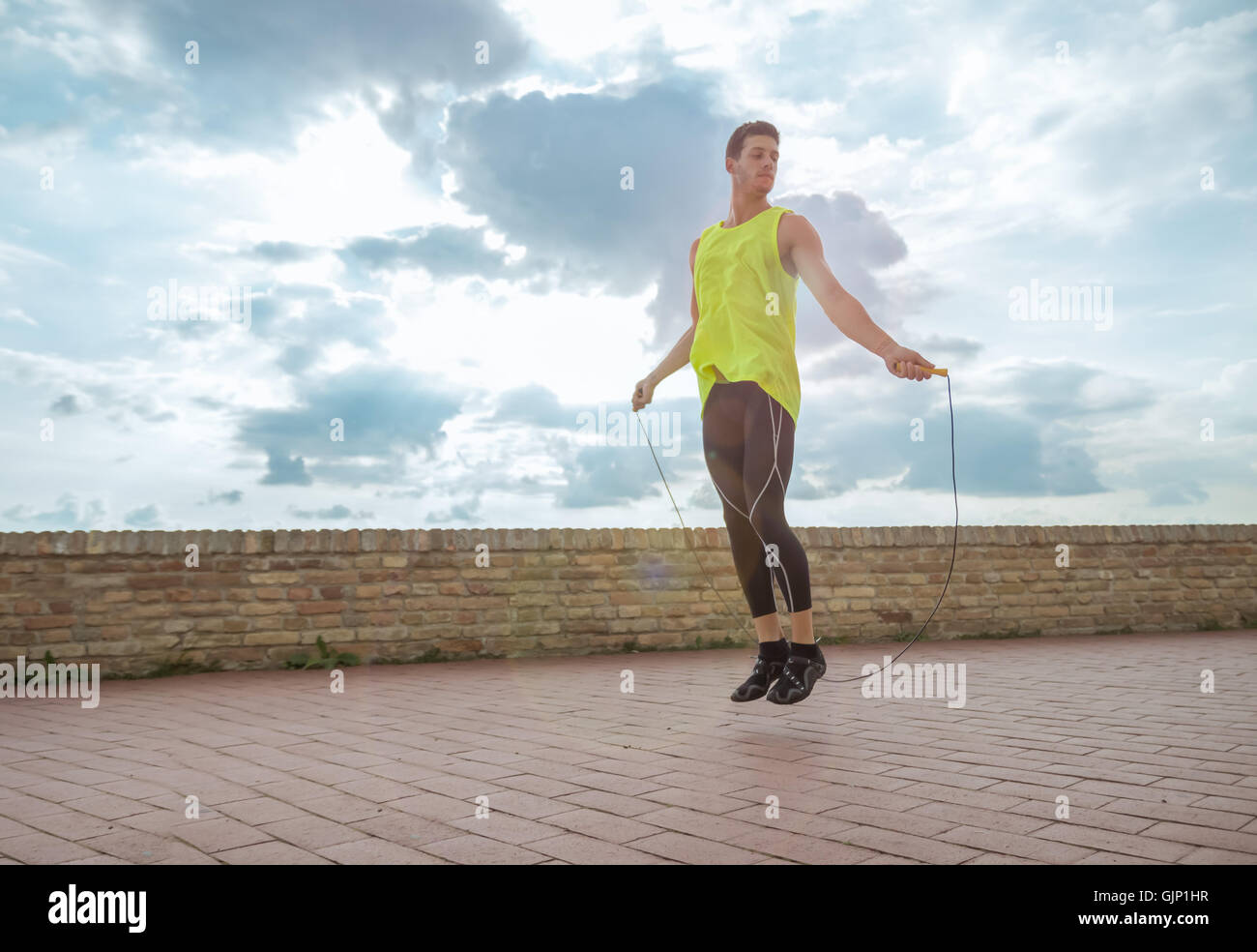 Fitness man jumping rope hi-res stock photography and images - Alamy