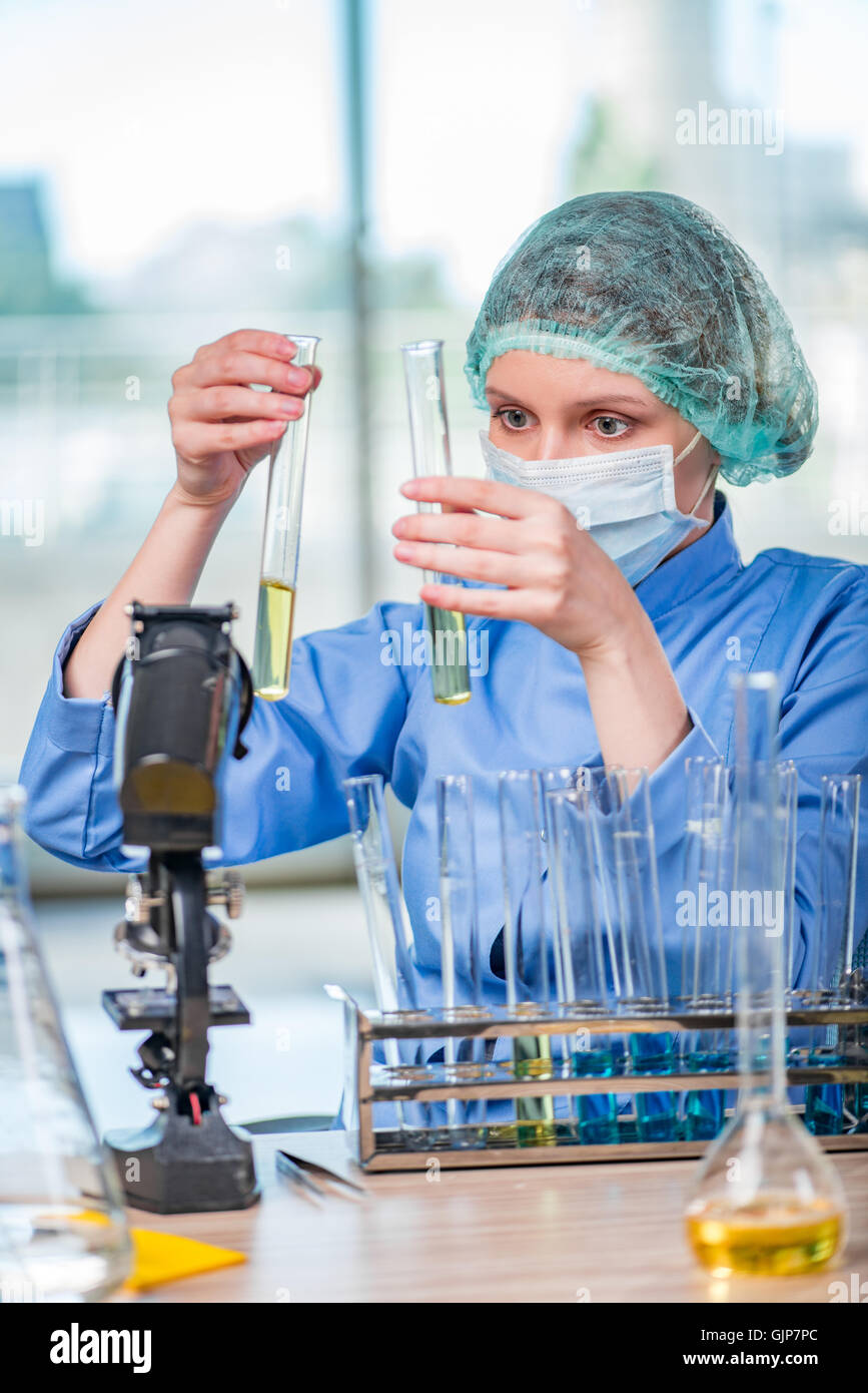Experienced lab assistant working on chemical solutions Stock Photo - Alamy