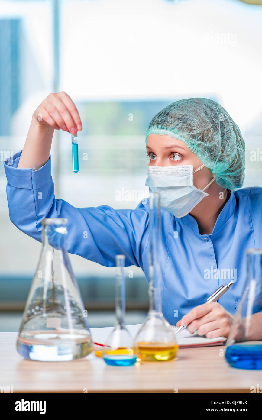 Experienced lab assistant working on chemical solutions Stock Photo - Alamy