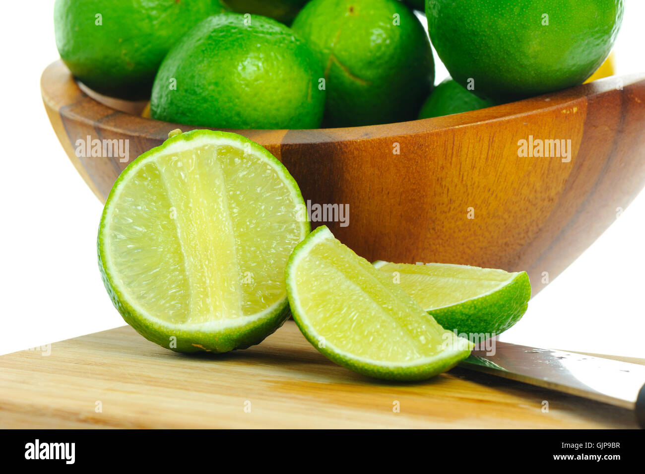 Fresh green limes isolated on white background Stock Photo - Alamy