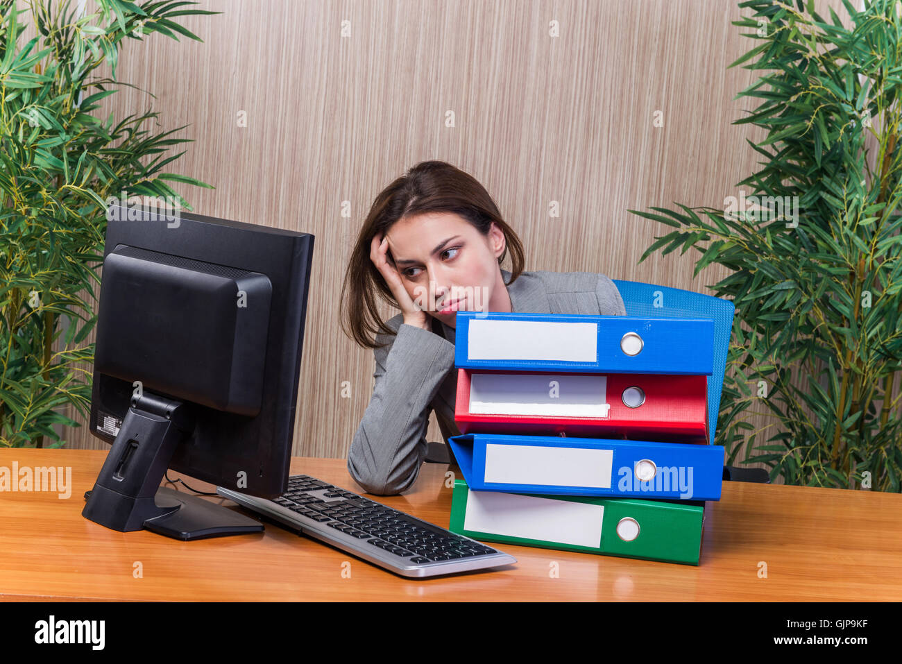 Tired woman stressed with too much work Stock Photo - Alamy