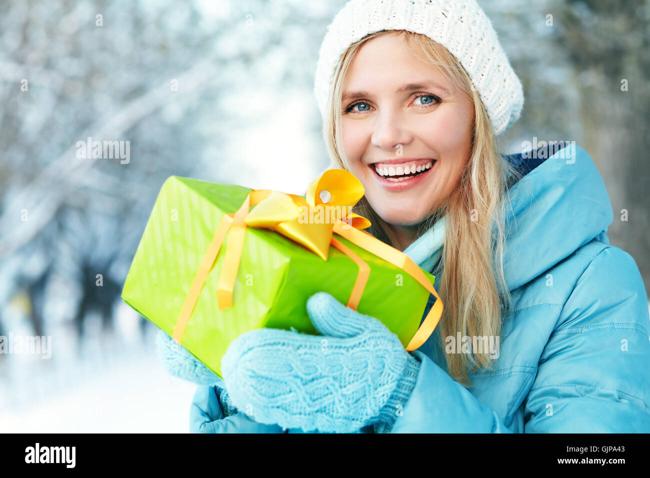 woman with a gift in their hands Stock Photo - Alamy