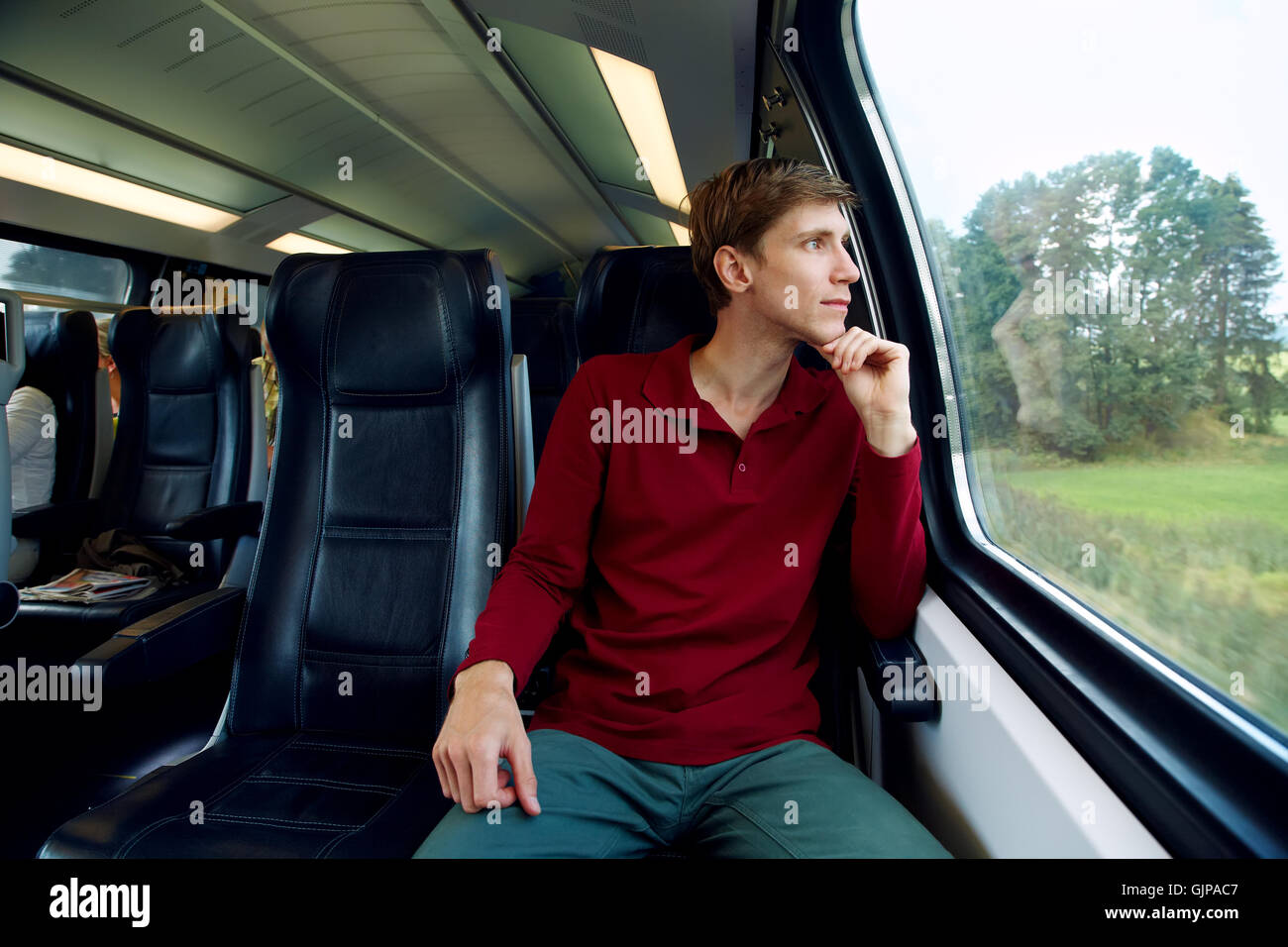 handsome man riding on a train Stock Photo - Alamy