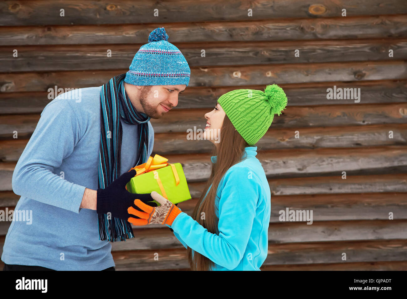 Young man gives gift box hi-res stock photography and images - Alamy