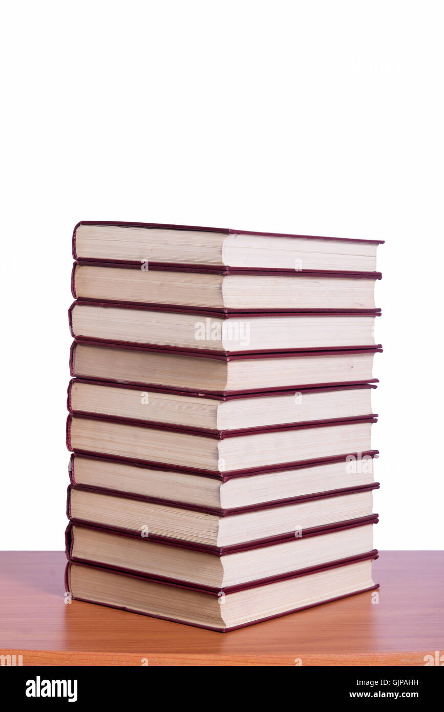 Stack of books arranged the office desk Stock Photo - Alamy