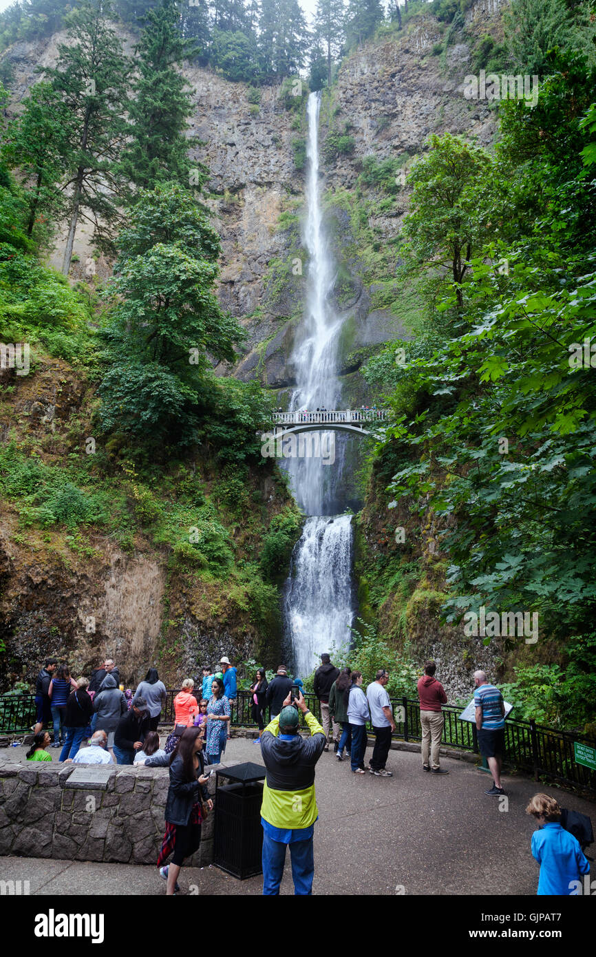 Tourists gather at the base of Multnomah Falls along the Columbia River ...