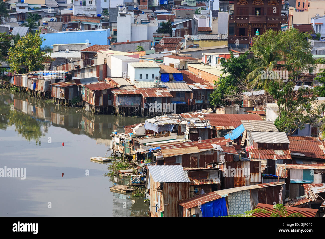 Colorful squatter shacks and houses in a Slum Urban Area in Saigon ...