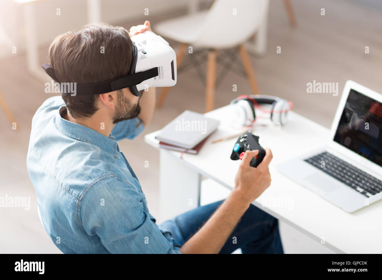 Involved man laying video games Stock Photo - Alamy