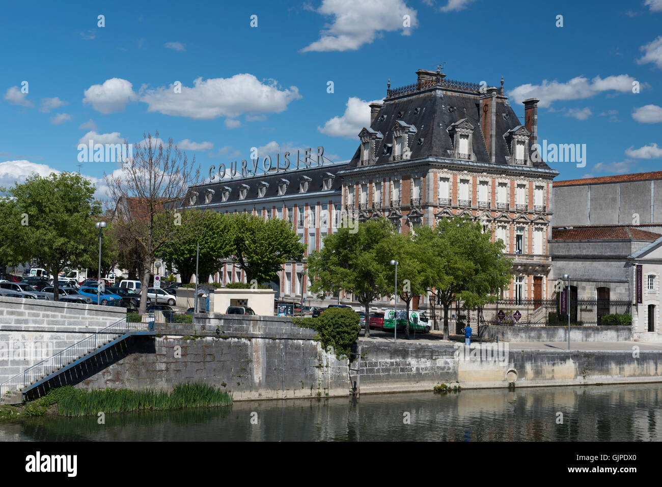 Courvoisier cognac distillery next to the Charente River in Jarnac ...