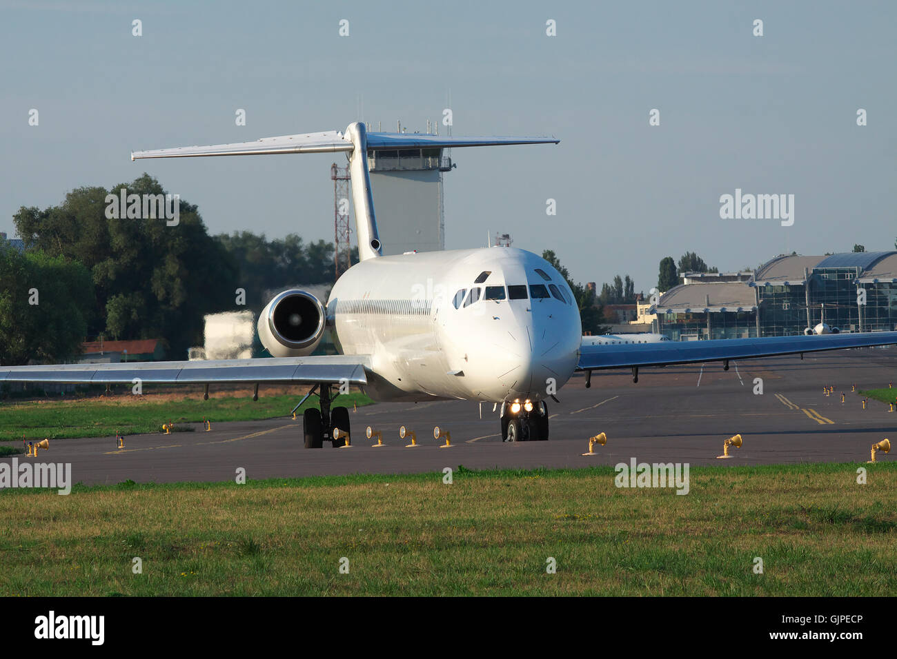 Passenger plane front view taxiing to the runway Stock Photo - Alamy