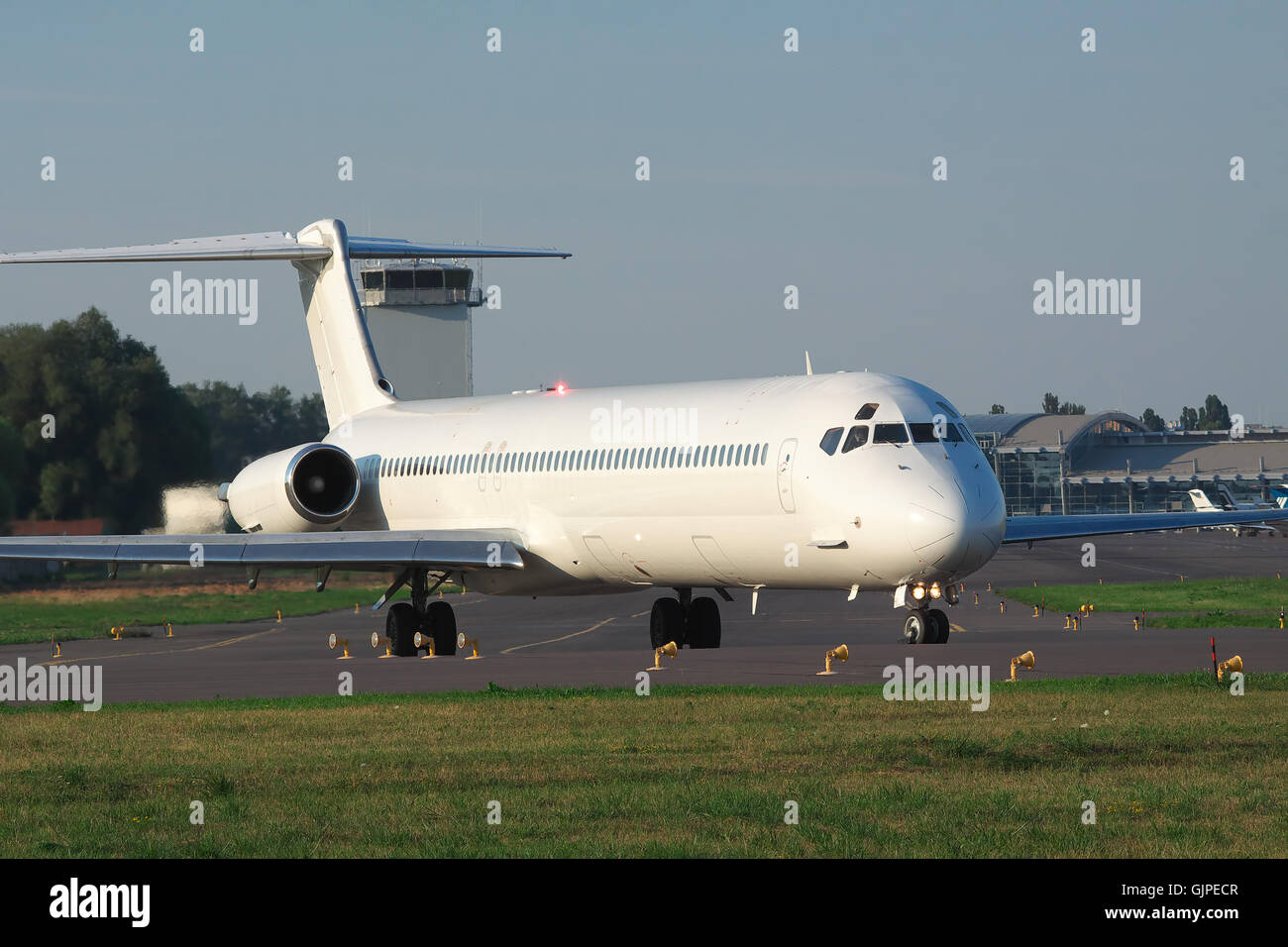 Passenger plane front view taxiing to the runway for takeoff Stock ...
