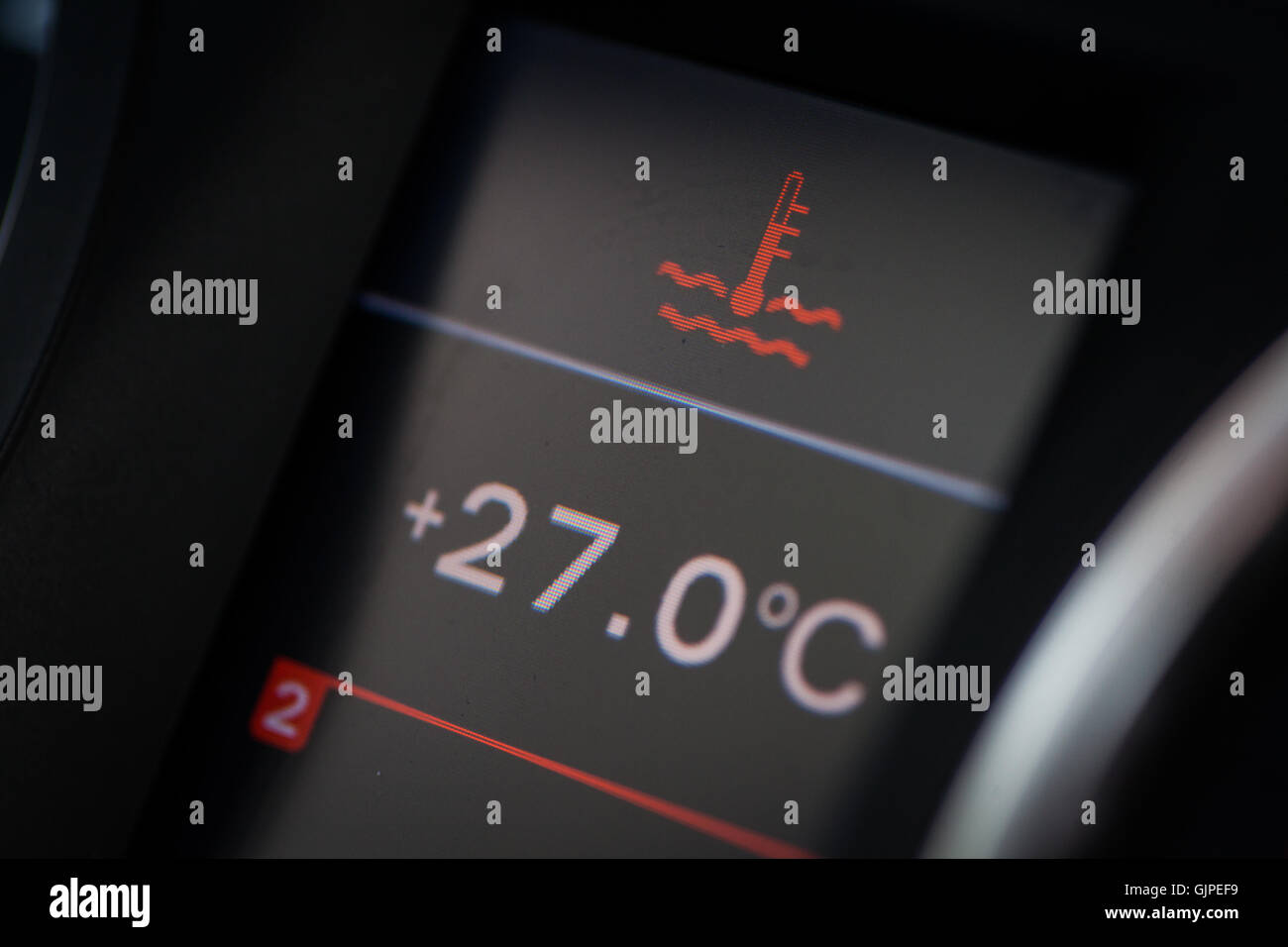 Close up shot of a car's electronic dashboard, with coolant warning on ...