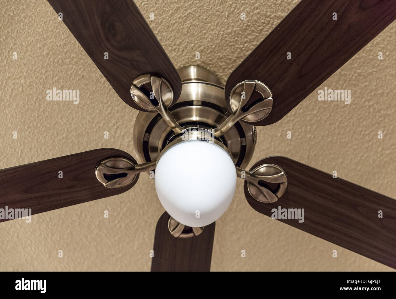 Wooden ceiling fan with light Stock Photo - Alamy