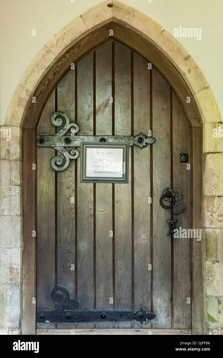 Old wooden door in St Wulfran's church in Ovingdean, East Sussex ...