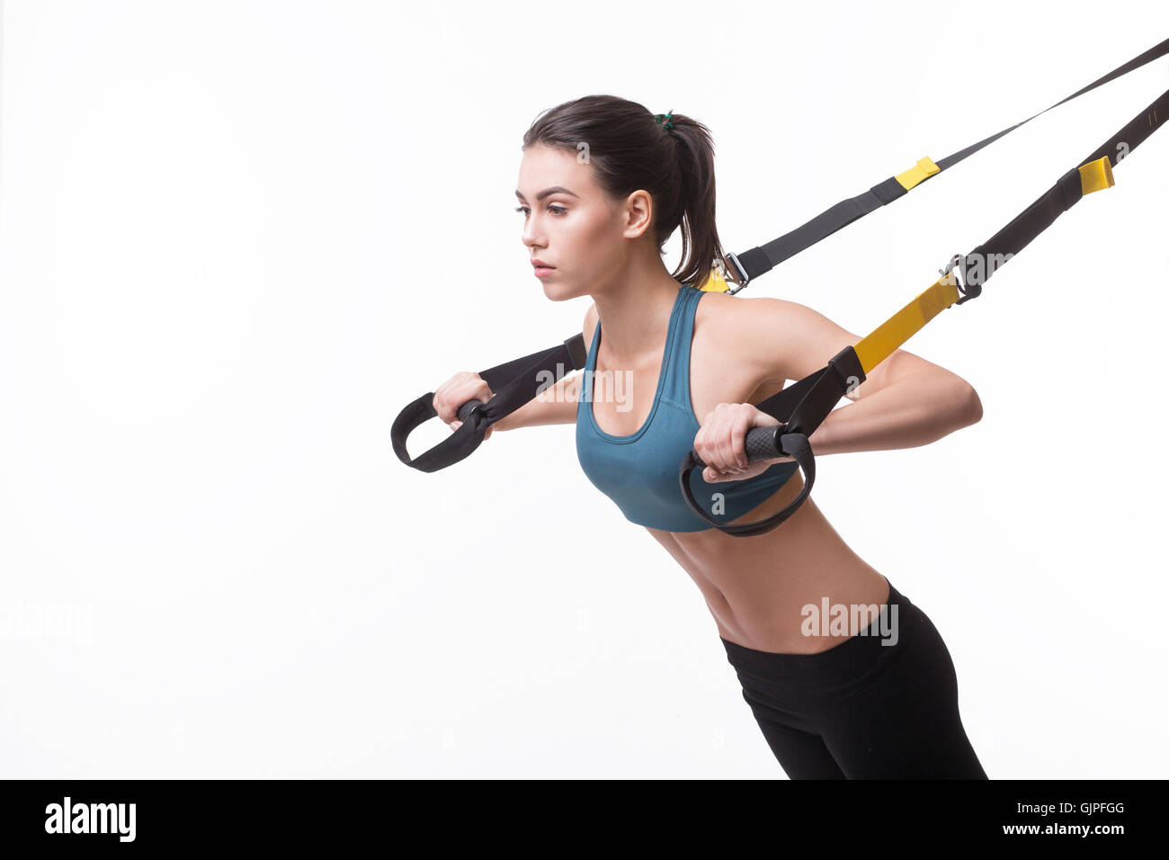 Woman training with suspension trainer sling Stock Photo - Alamy