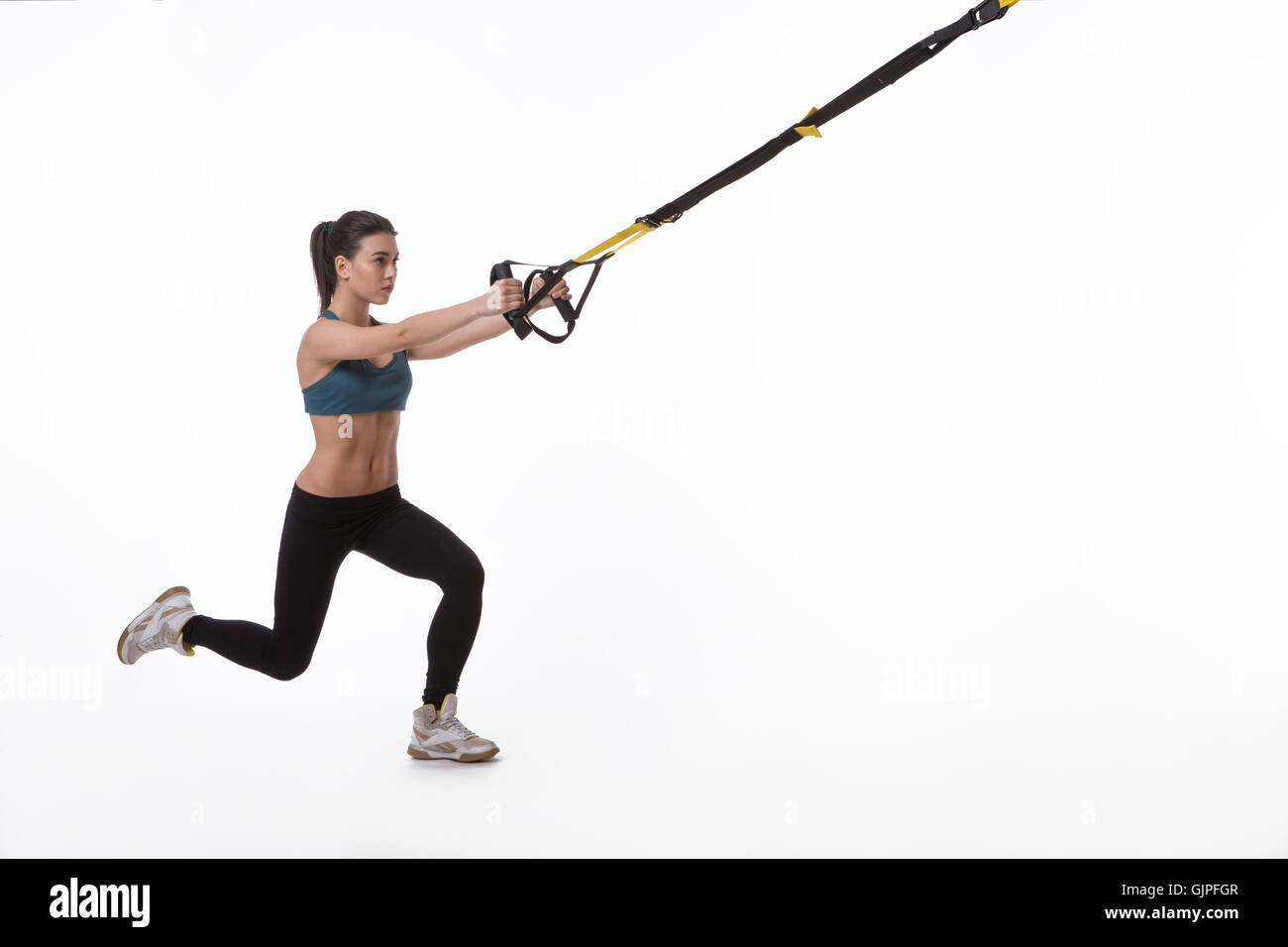 Woman training with suspension trainer sling Stock Photo - Alamy
