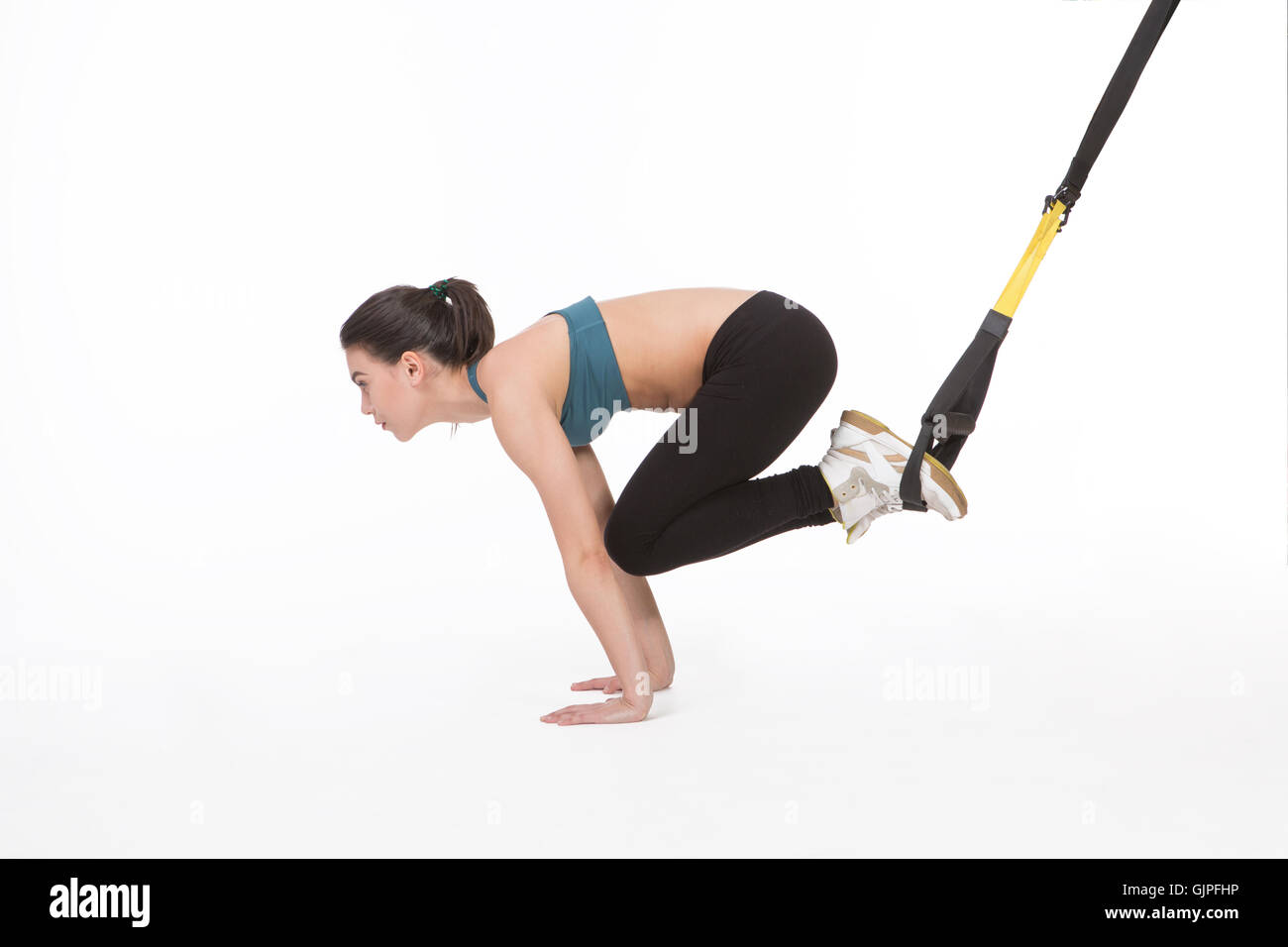 Woman training with suspension trainer sling Stock Photo - Alamy