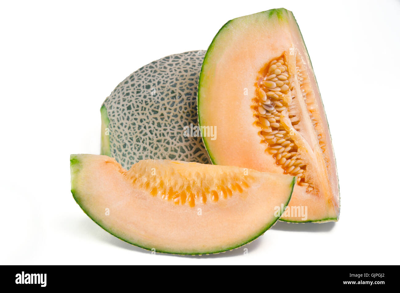 Cucumis melo or melon with half and seeds on white (Other names are ...