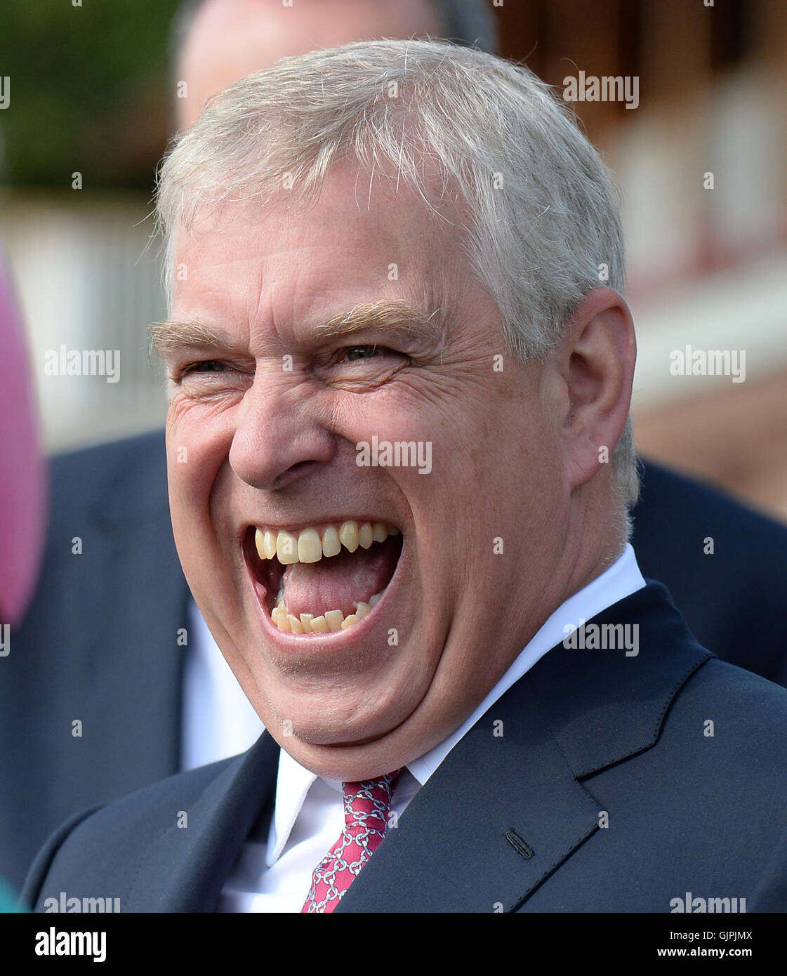 The Duke of York laughs as he visits the parade ring during day one of ...