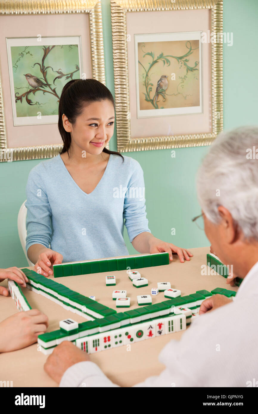 A people playing mahjong Stock Photo - Alamy