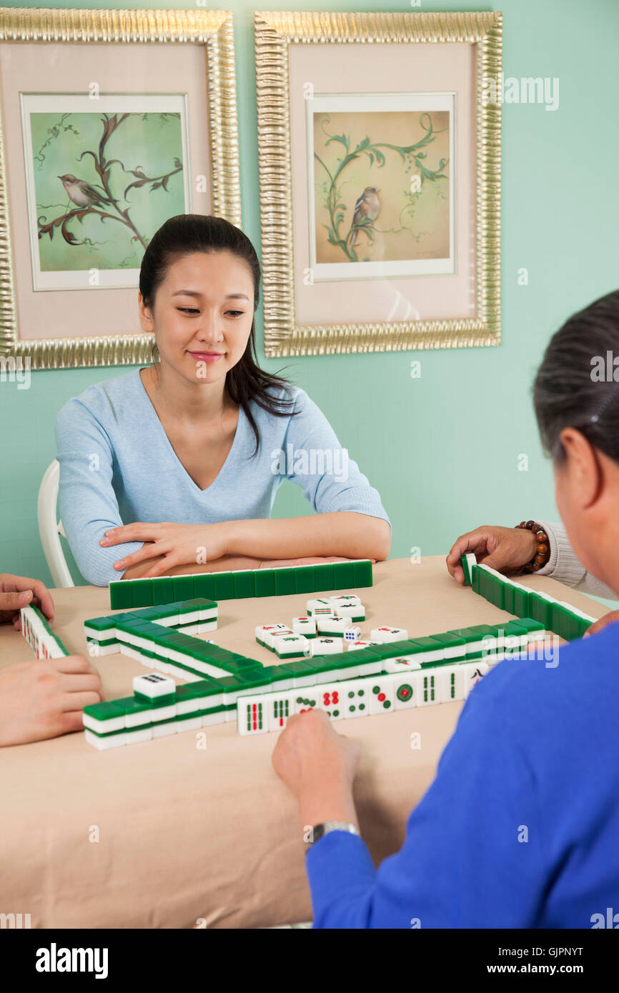 A people playing mahjong Stock Photo - Alamy