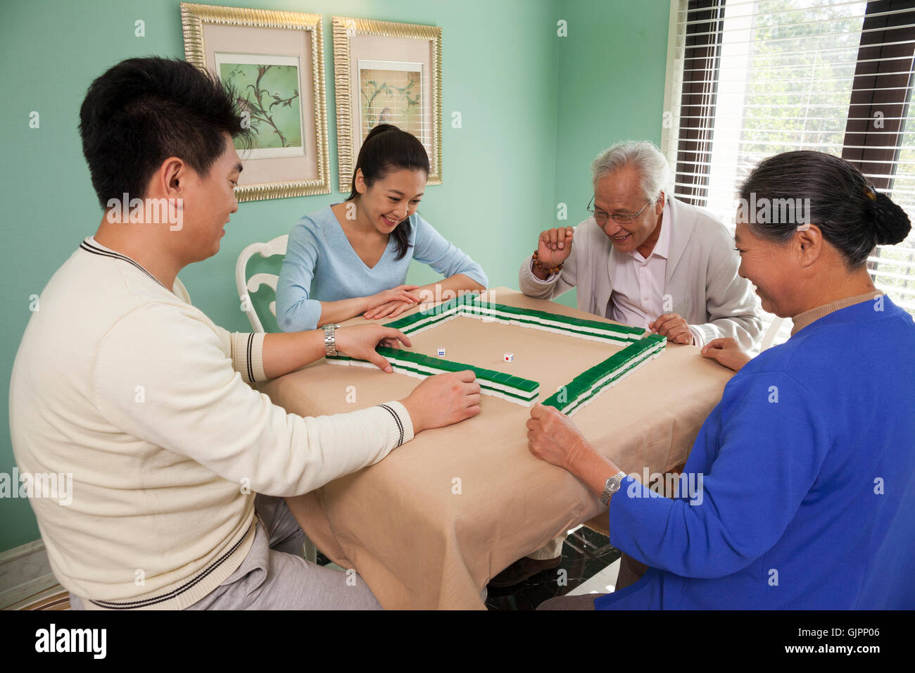A people playing mahjong Stock Photo - Alamy