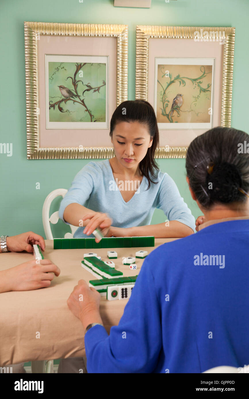 Chinese family playing mahjong hi-res stock photography and images - Alamy