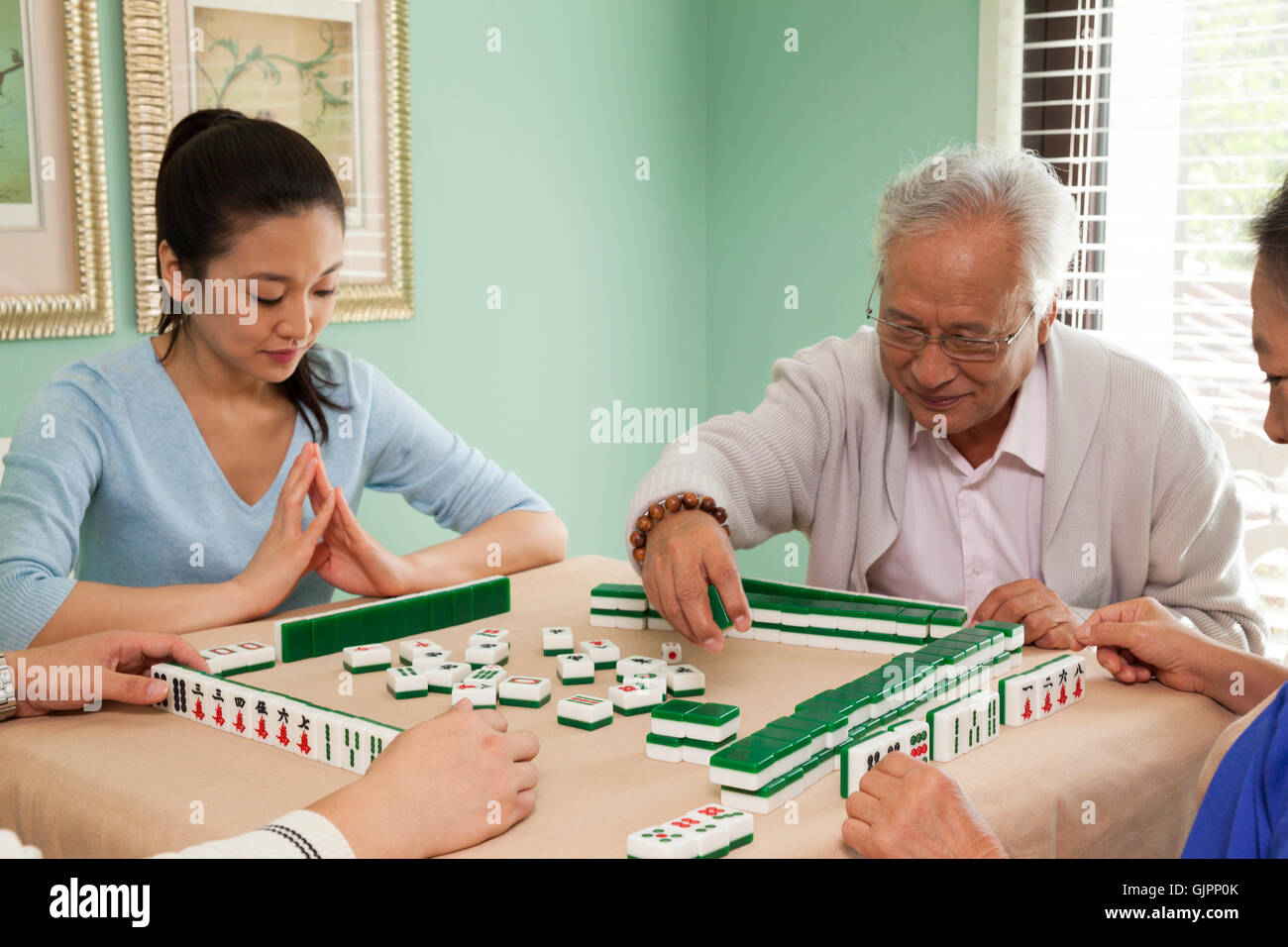 A people playing mahjong Stock Photo - Alamy