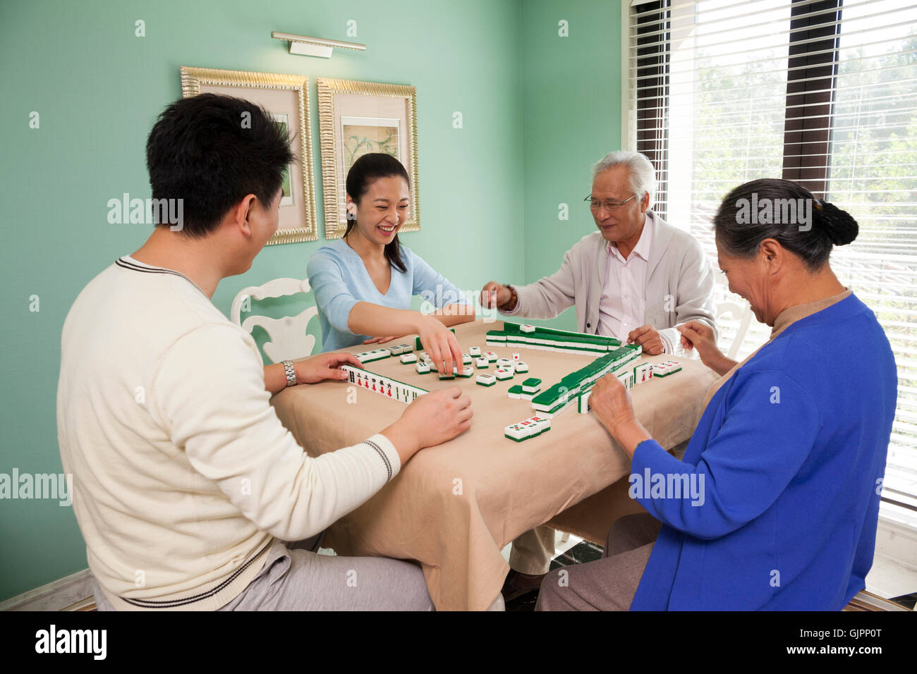 A people playing mahjong Stock Photo - Alamy