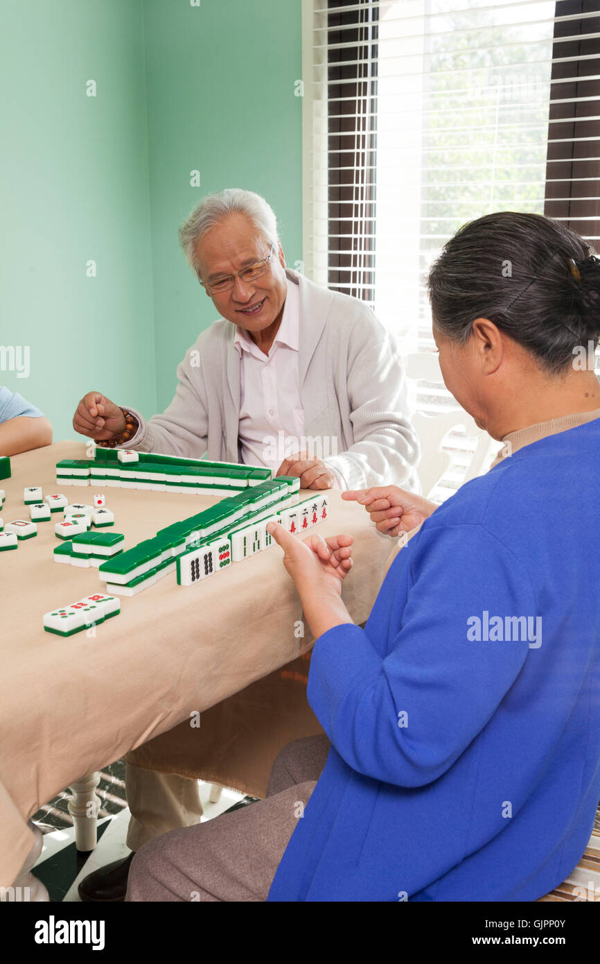 Chinese family playing mahjong hi-res stock photography and images - Alamy