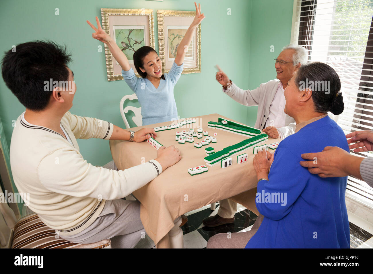 A people playing mahjong Stock Photo - Alamy