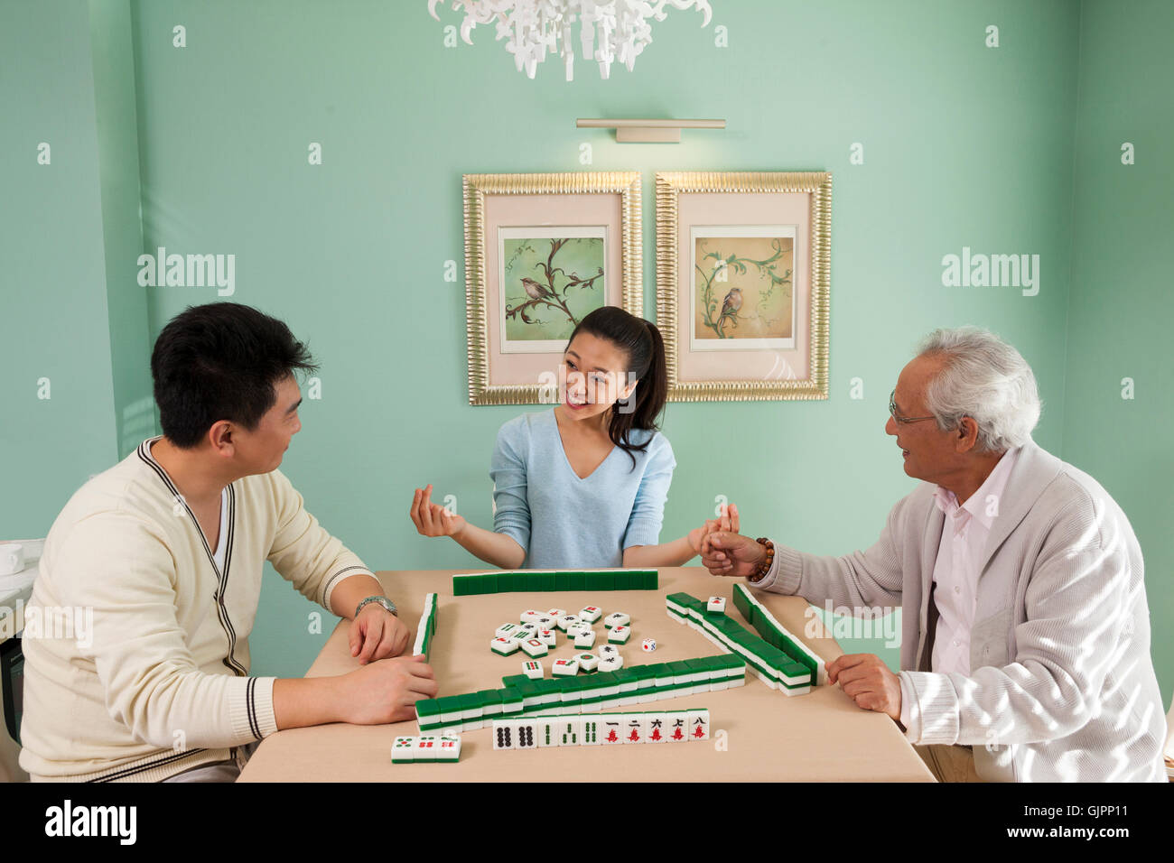 A people playing mahjong Stock Photo - Alamy