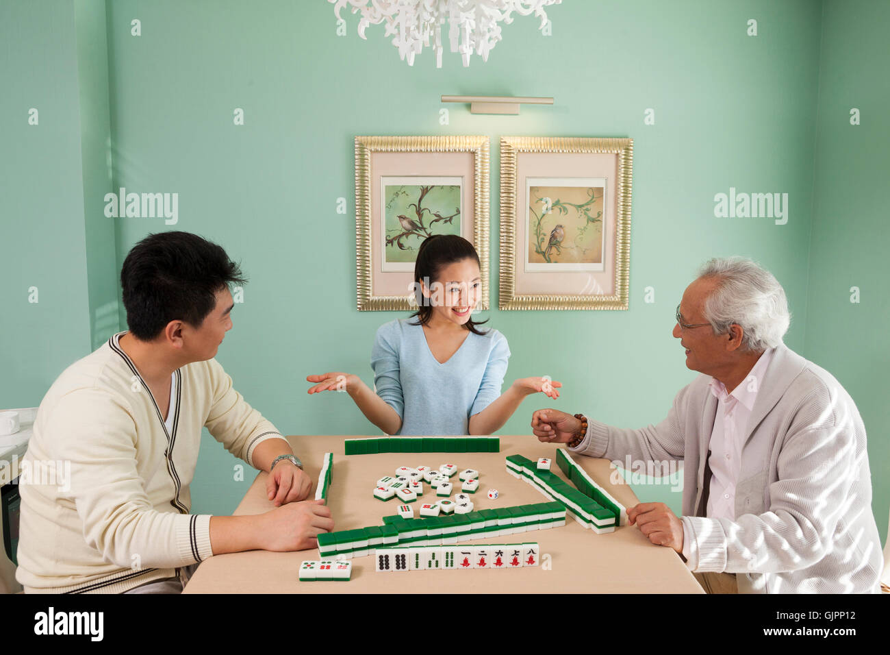 A people playing mahjong Stock Photo - Alamy