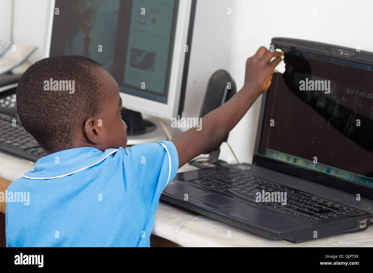 screen of this laptop is dusty what drives this child to clean Stock ...