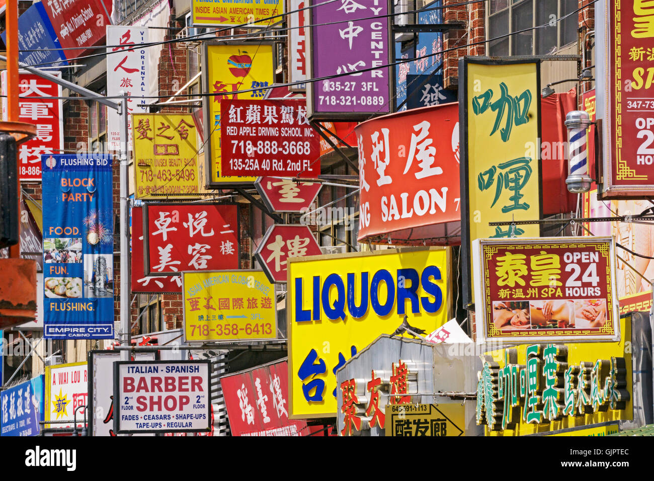 Multitude of street signs on 40th Road in Chinatown, Flushing, Queens ...