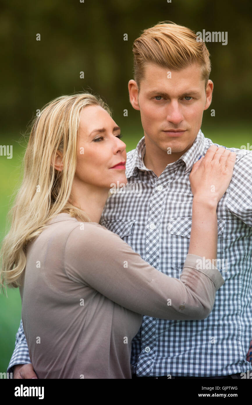 Couple standing outdoors hi-res stock photography and images - Alamy