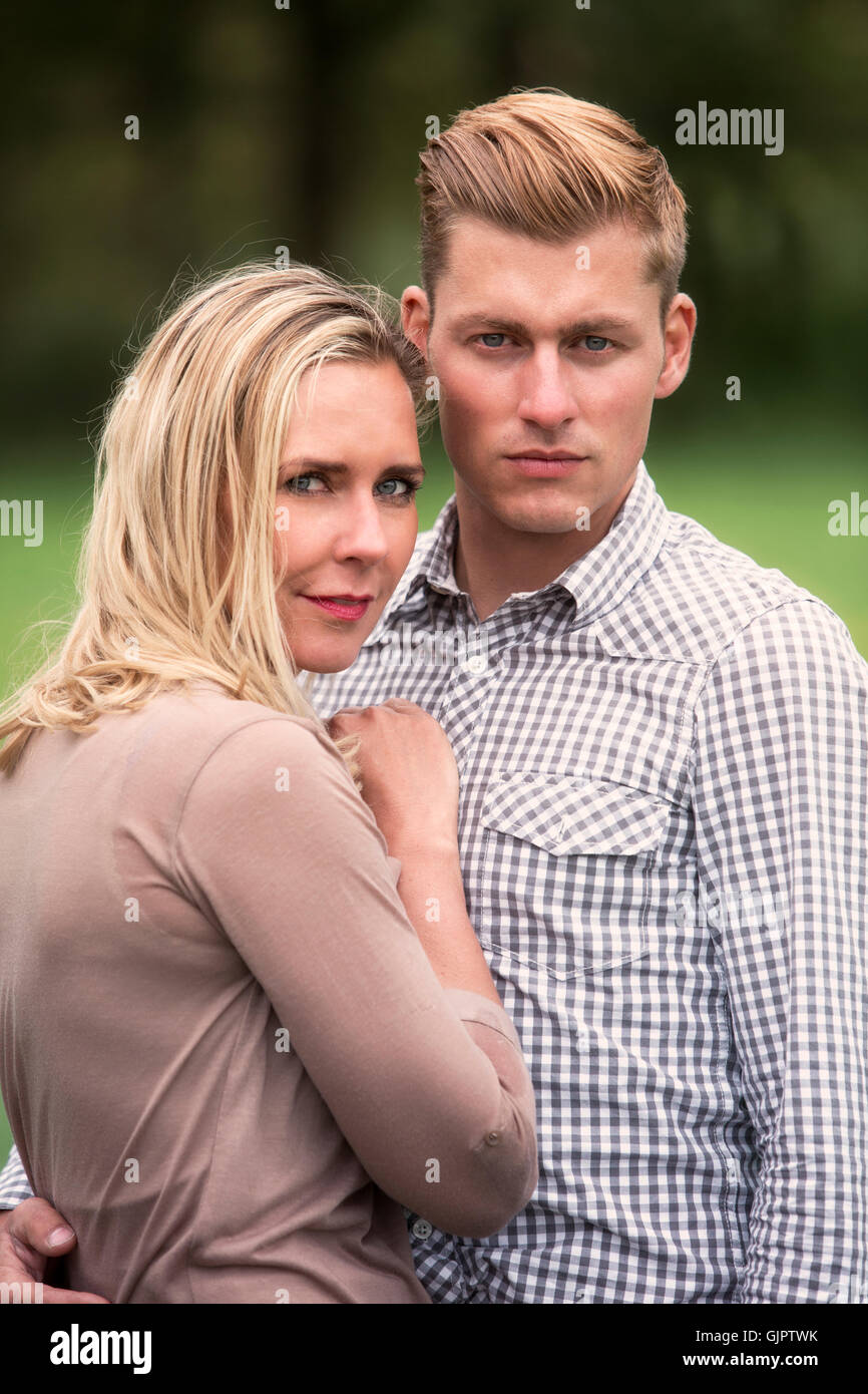 Couple standing outdoors hi-res stock photography and images - Alamy