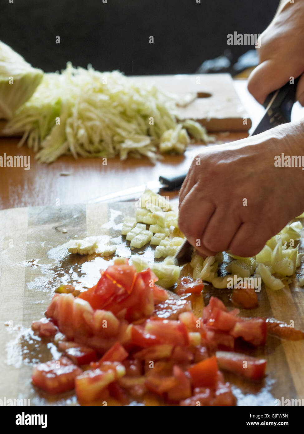 Woman cutting fresh vegetables hi-res stock photography and images - Alamy
