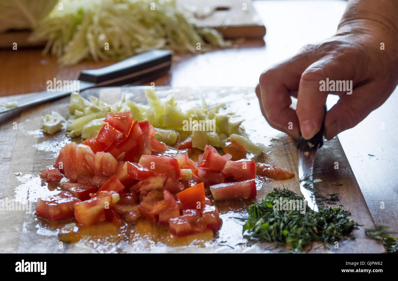 Woman cutting fresh cabbage hi-res stock photography and images - Alamy