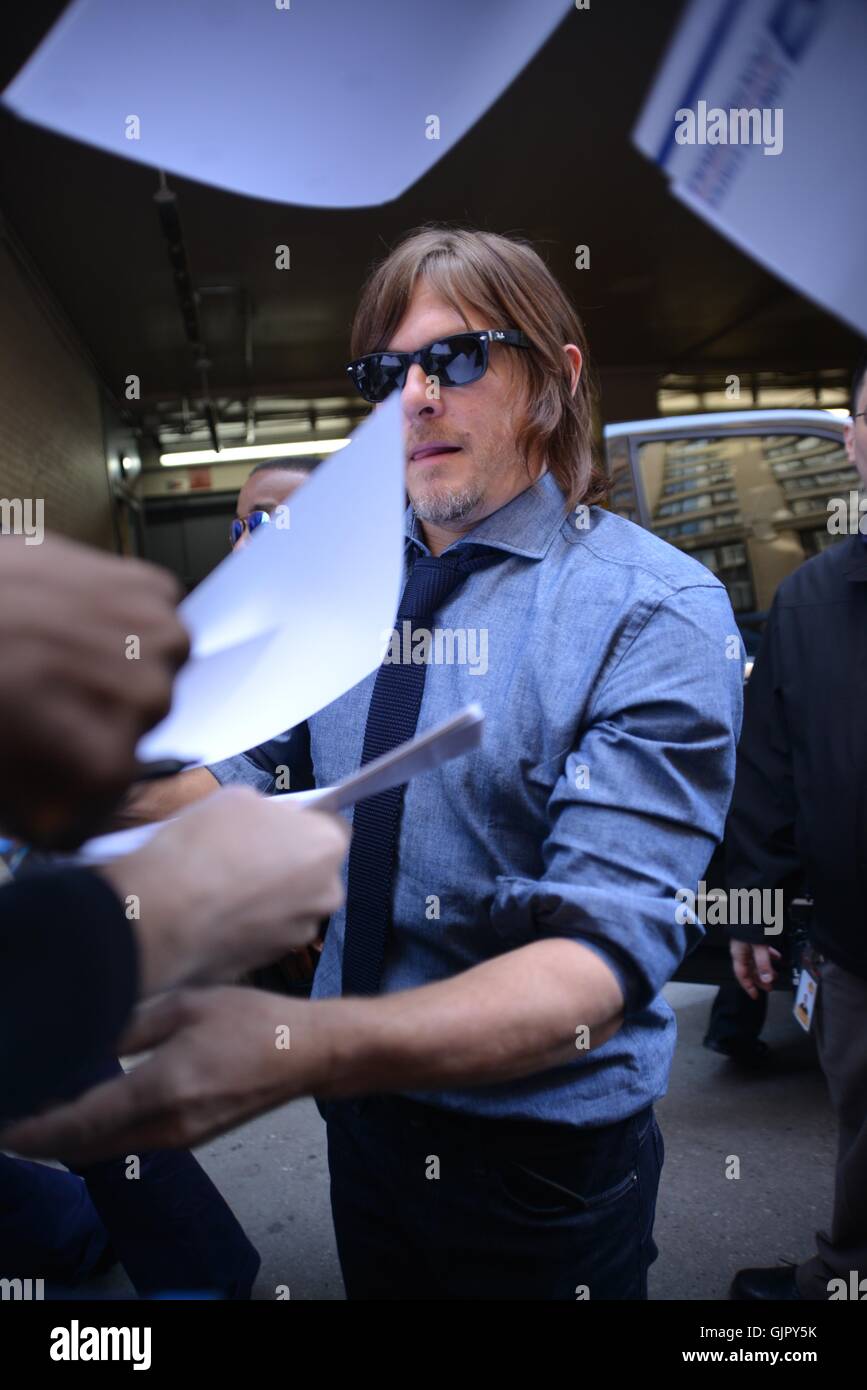 Norman Reedus signing autographs as he leaves a venue Featuring: Norman ...