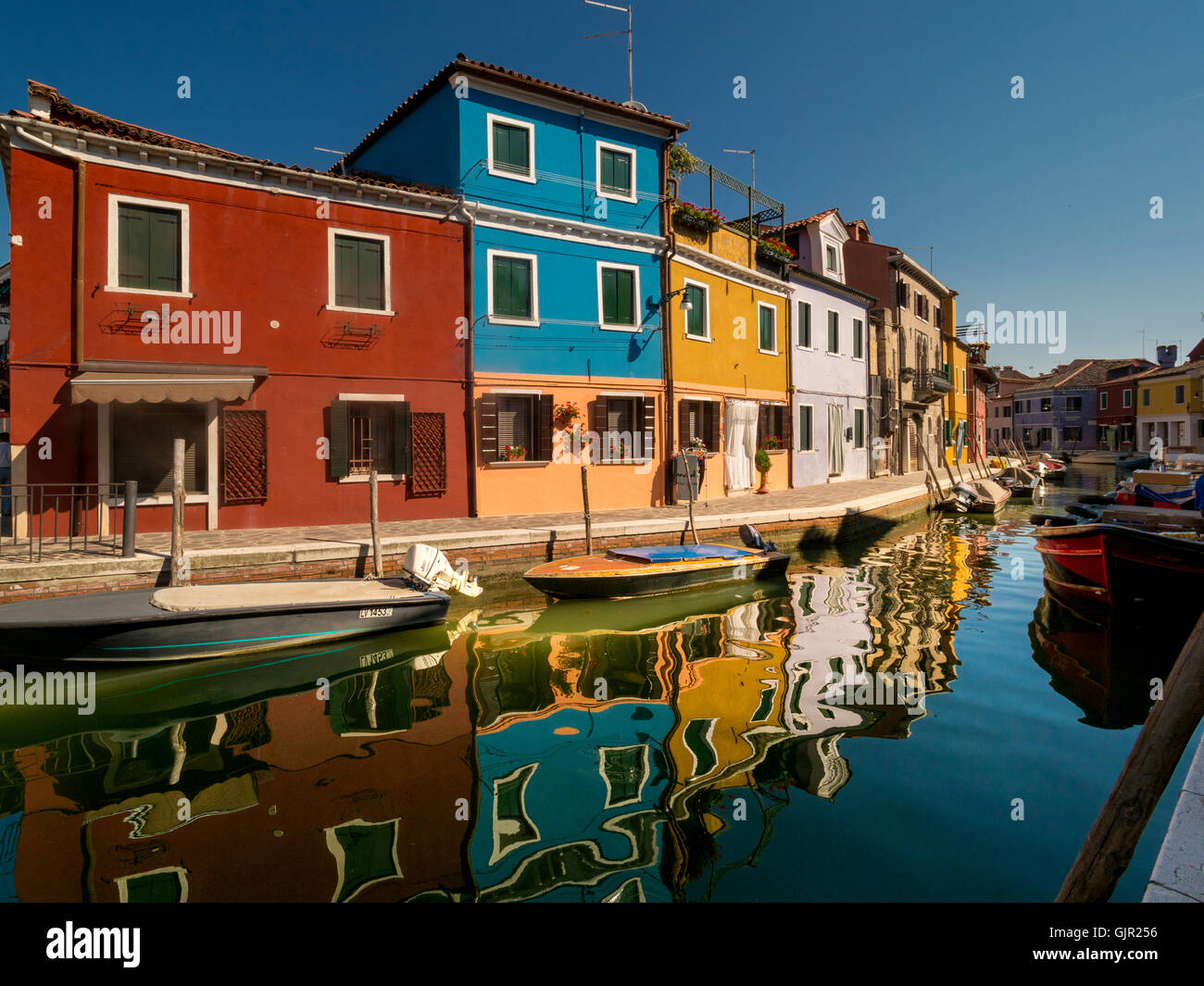 The traditional colourful painted canalside terrace houses on the ...